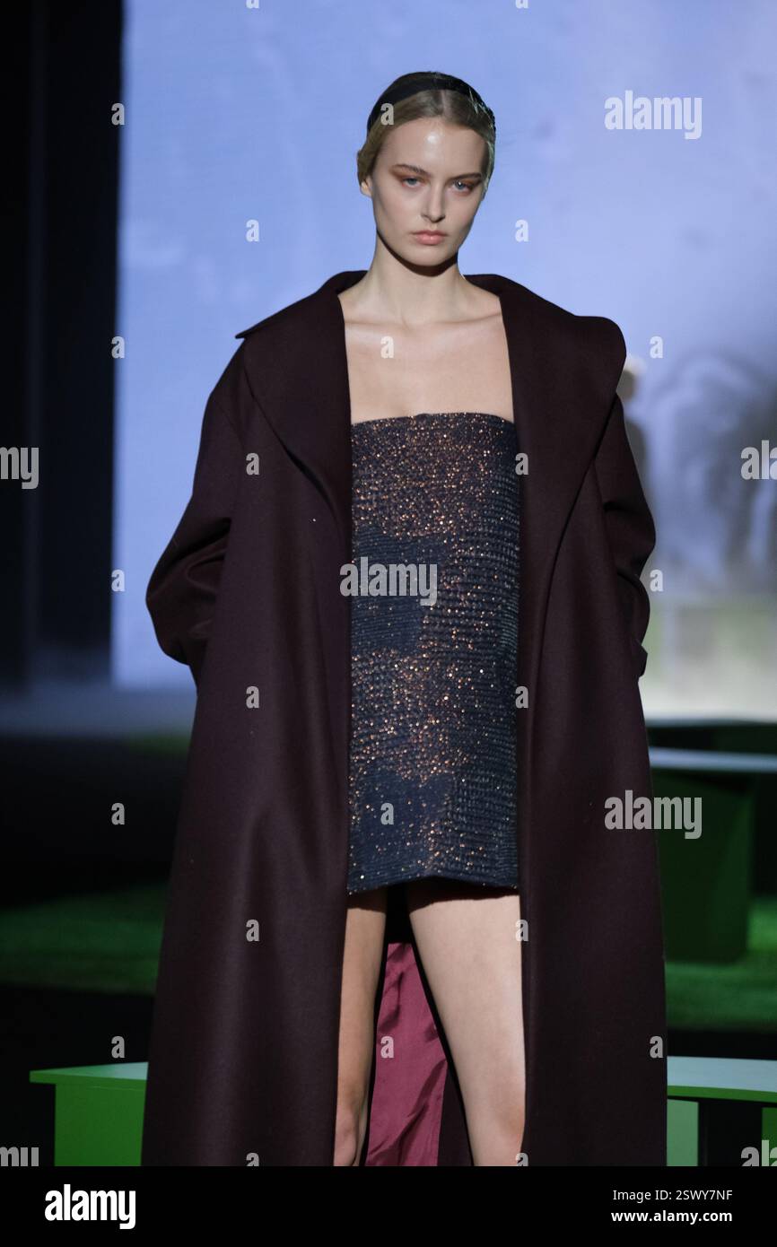 A model walks the runway wearing a design by Fely Campo during Mercedes ...