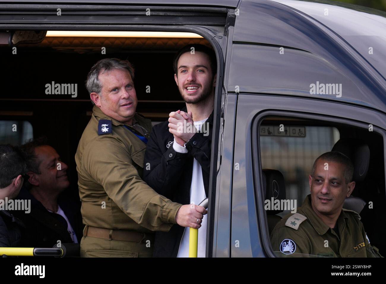 Freed Israeli hostage Omer Shem Tov looks on from a van as he arrives ...