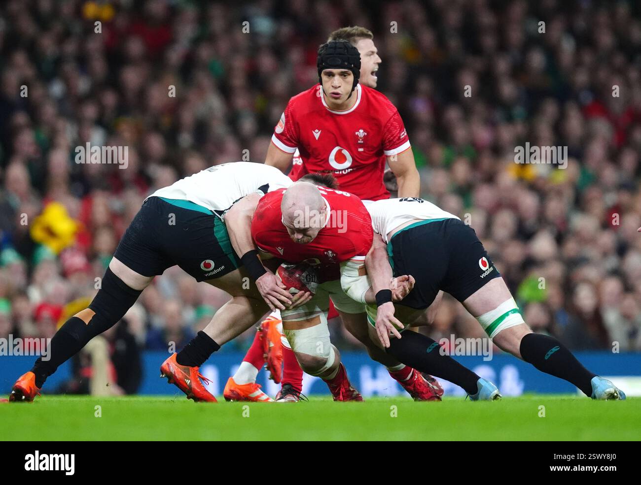 Wales' WillGriff John tackled by Ireland's Dan Sheehan and Joe McCarthy ...
