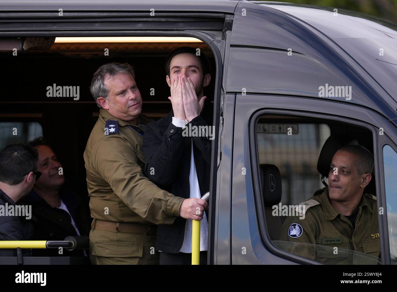 Freed Israeli hostage Omer Shem Tov looks on from a van as he arrives ...