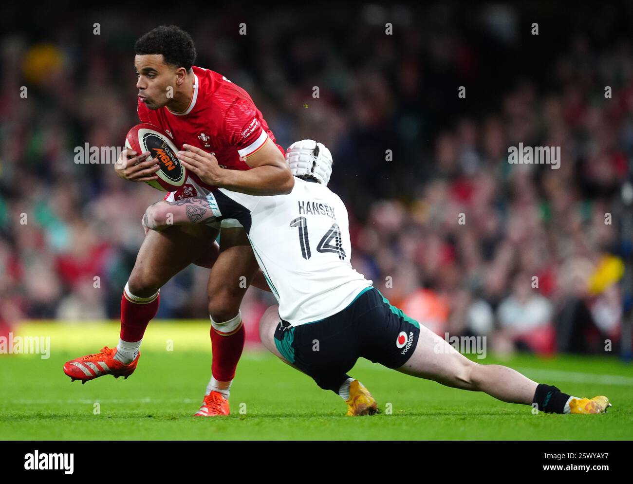 Wales' Ben Thomas tackled by Ireland's Mack Hansen during the Guinness ...