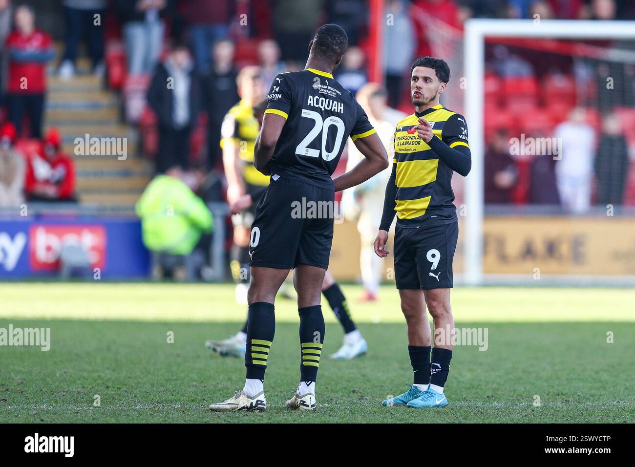 #9, Tyler Smith of Barrow AFC speaks to #20, Emile Acquah during the ...