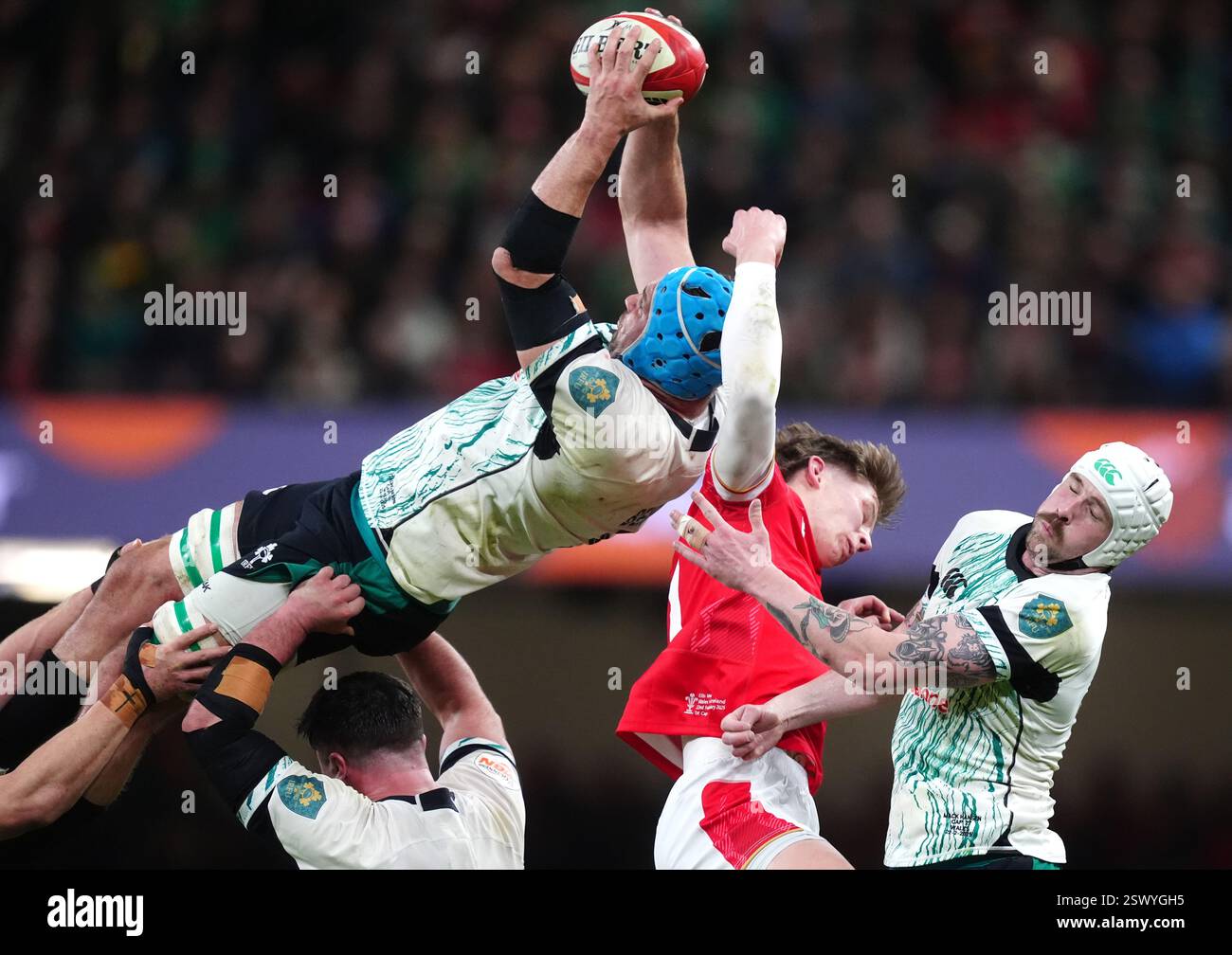 Ireland's Tadhg Beirne intercepts a high ball from Wales' Ellis Mee ...