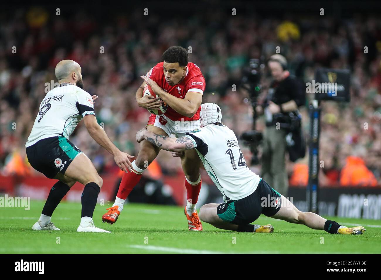 Ben Thomas of Wales is tackled by Mack Hansen of Ireland during the 2025 Guinness 6 Nations ...