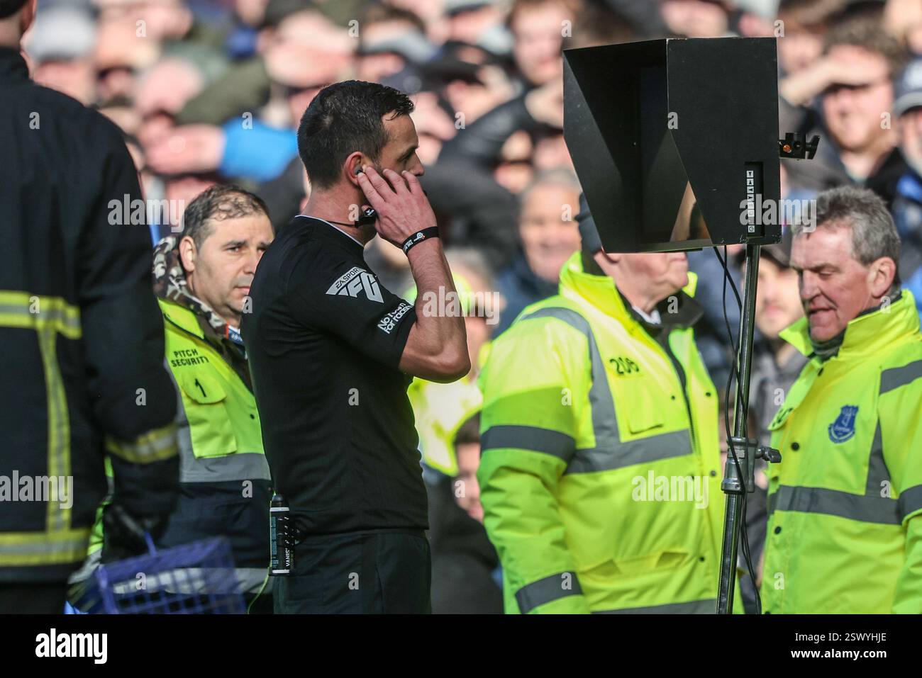 Referee Andy Madley checks the VAR screen for a penalty during the ...