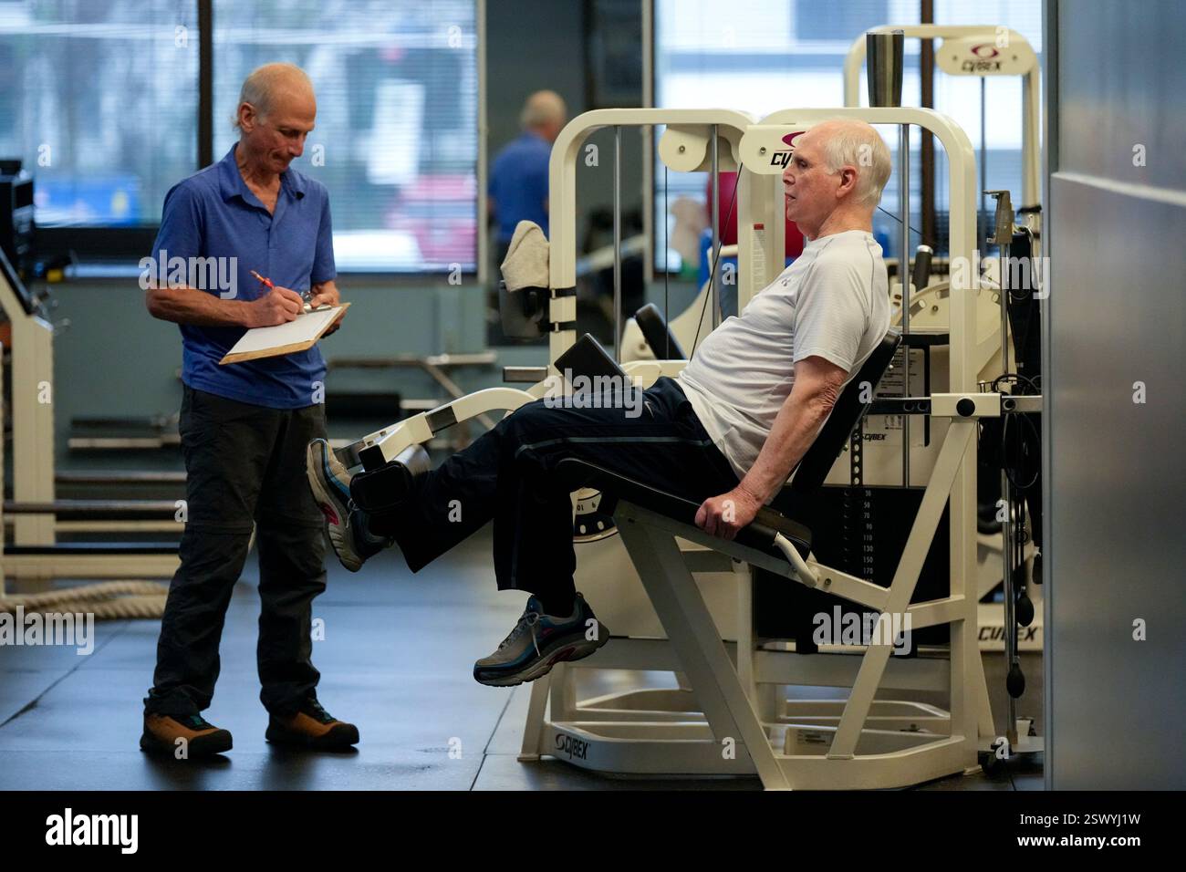 Dr. Grover Smith, right, works out with exercise scientist Dr. Irv ...