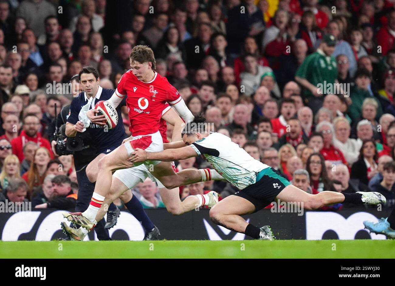 Wales' Ellis Mee tackled by Ireland's James Lowe during the Guinness Men's Six Nations match at ...