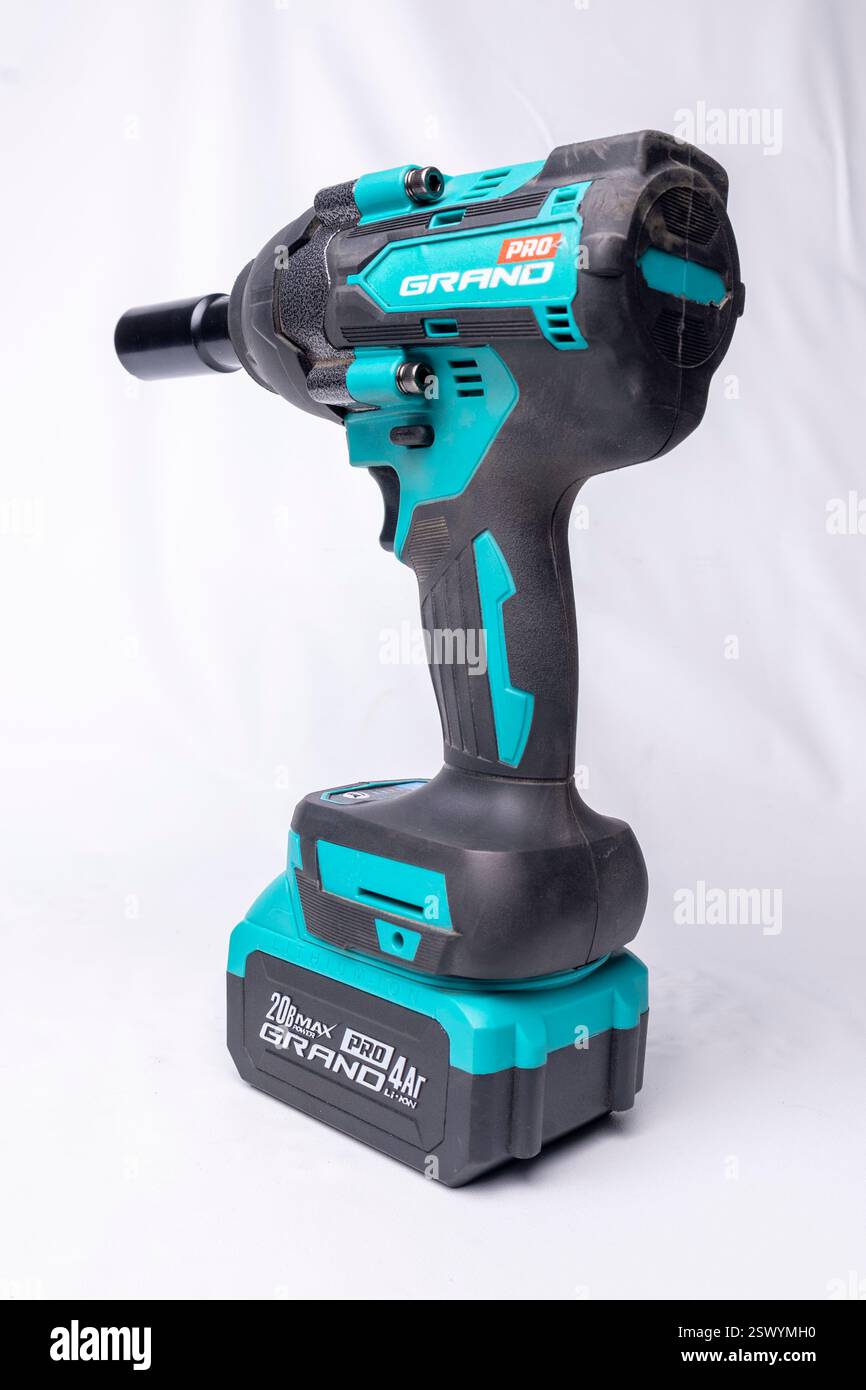 Powerful cordless impact wrench with battery attached, ready for ...