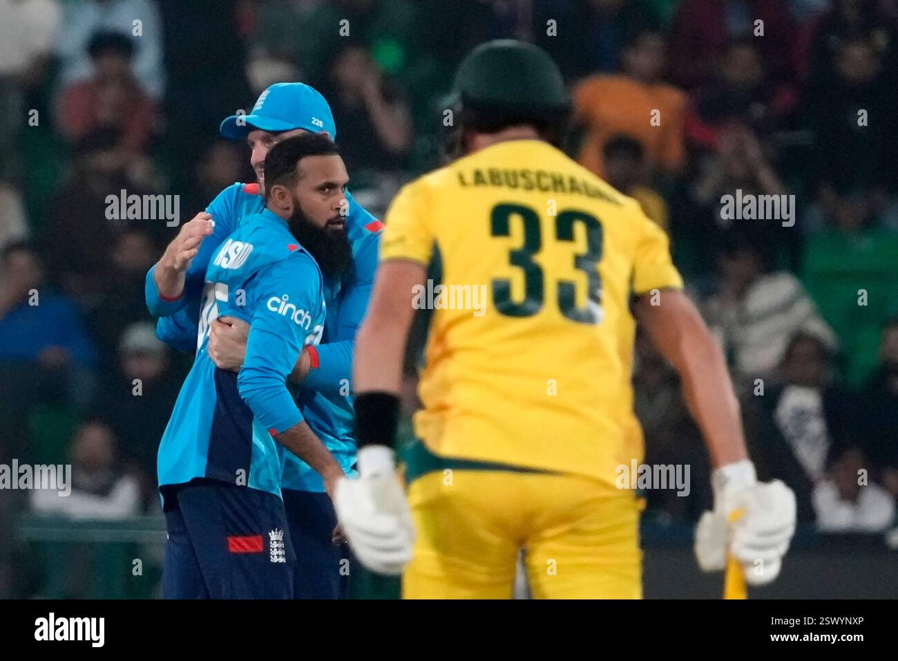 England's Adil Rashid, left, celebrates with Jos Buttler after the ...