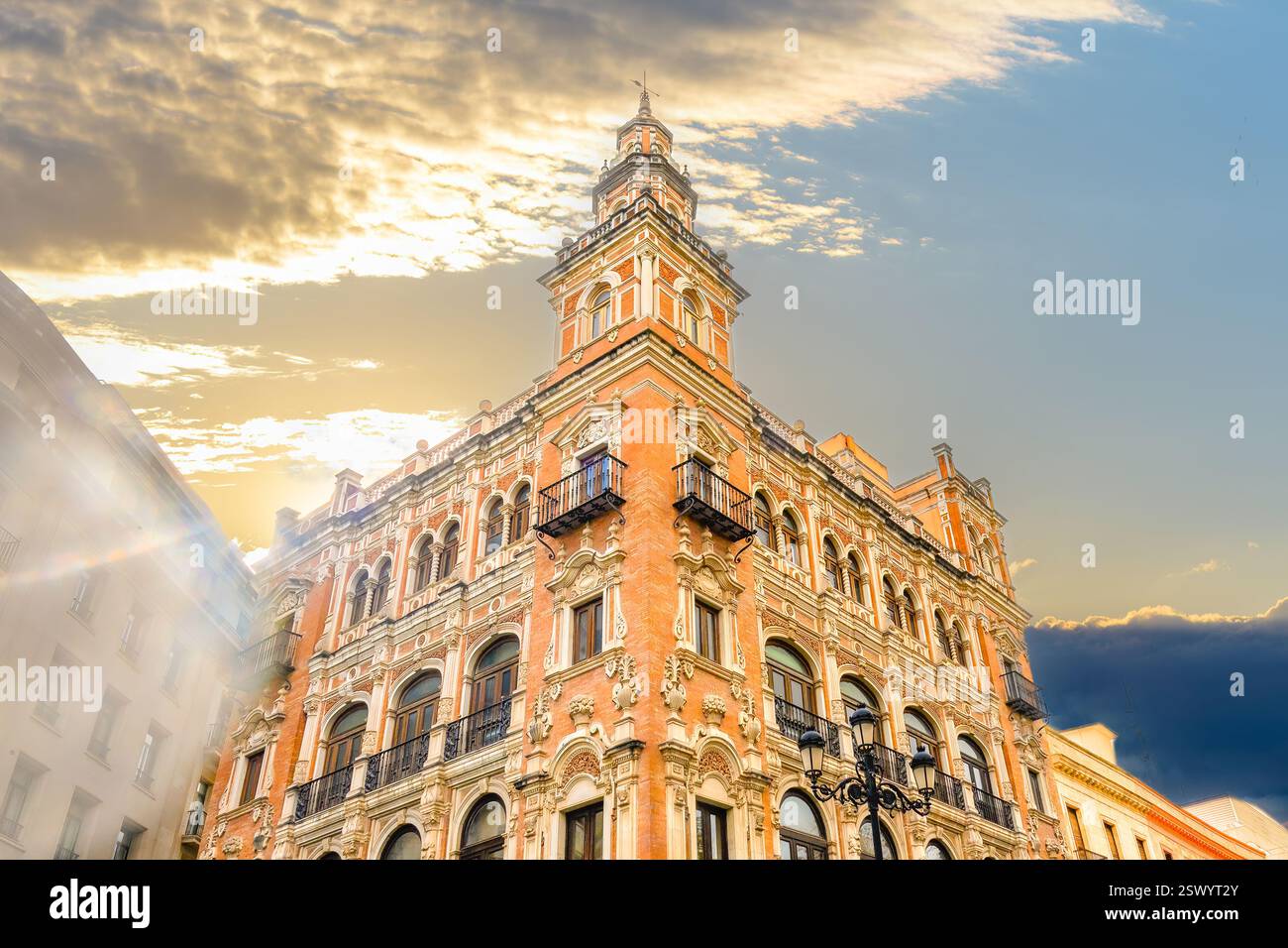Facade of the Telefonica building with a lens flare, Seville, Spain ...