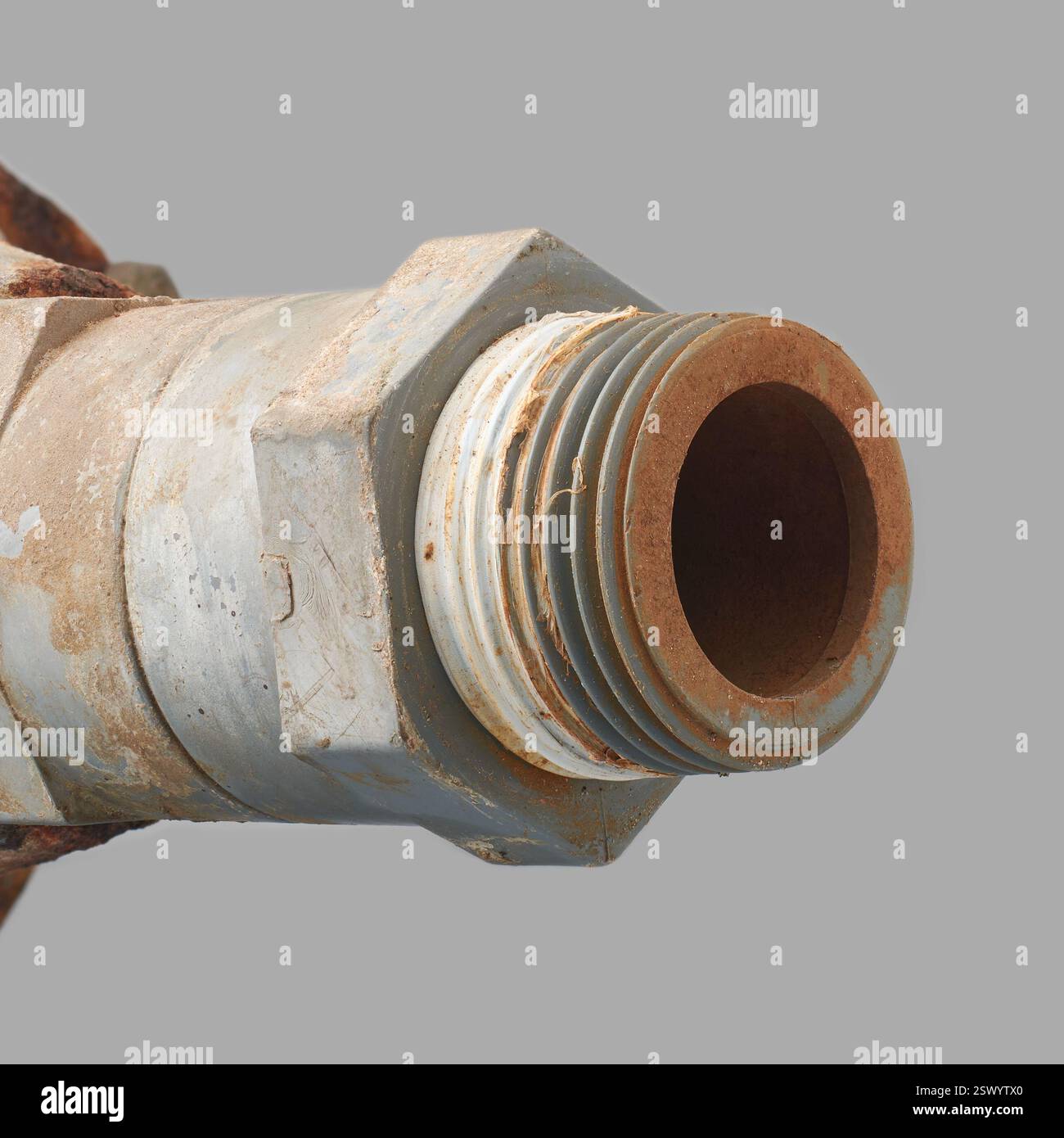 close-up of threaded end of old pvc pipe fittings with dirt and muddy ...