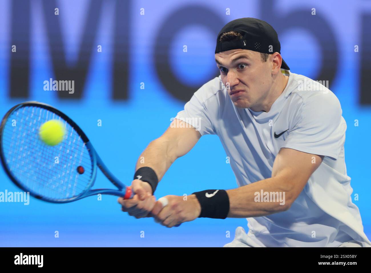 Britain's Jack Draper plays a shot against Russia's Andrey Rublev ...