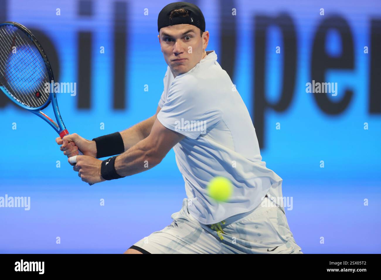 Britain's Jack Draper plays a shot against Russia's Andrey Rublev ...