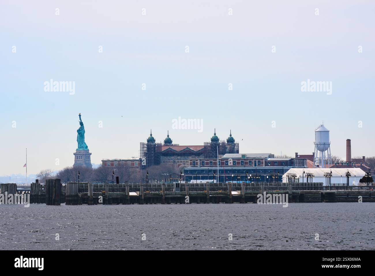 Ellis Island and the Statue of Liberty in view along New York Harbor ...