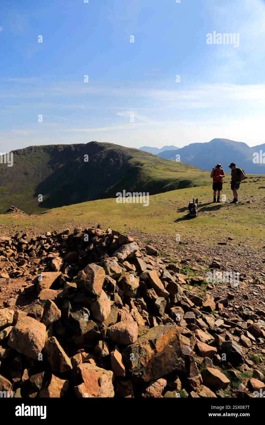 Walkers on the summit of Red Pike fell above Buttermere, Lake District ...