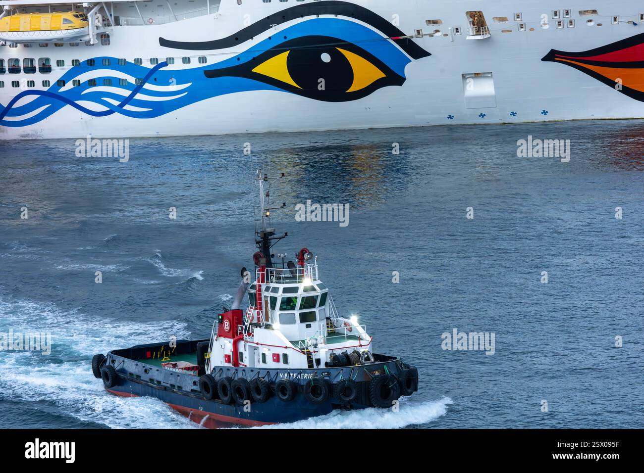 Port Santa Cruz de Tenerife, Spain, a tug boat passes the aidacosma ...