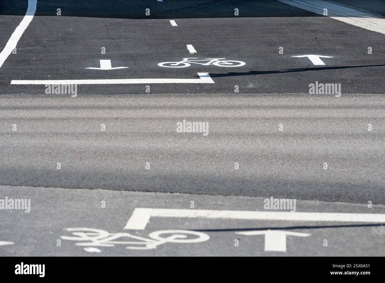Bike path crossing road Stock Photo - Alamy
