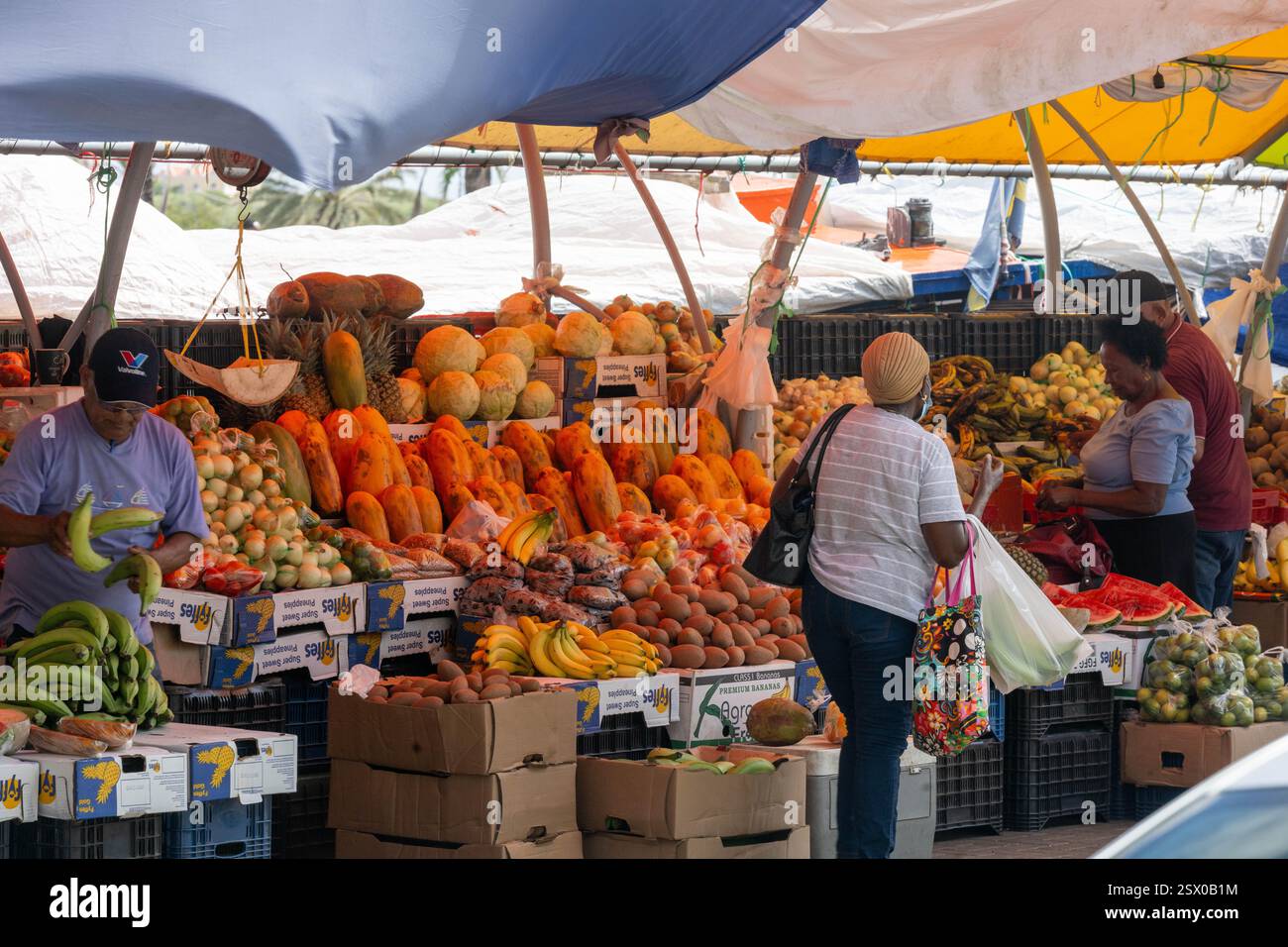 The Floating Market in Willemstad, Curaçao, is a vibrant and culturally ...