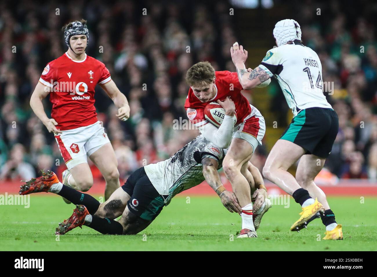 Cardiff, UK. 22nd Feb, 2025. Ellis Mee of Wales is tackled during the 2025 Guinness 6 Nations ...