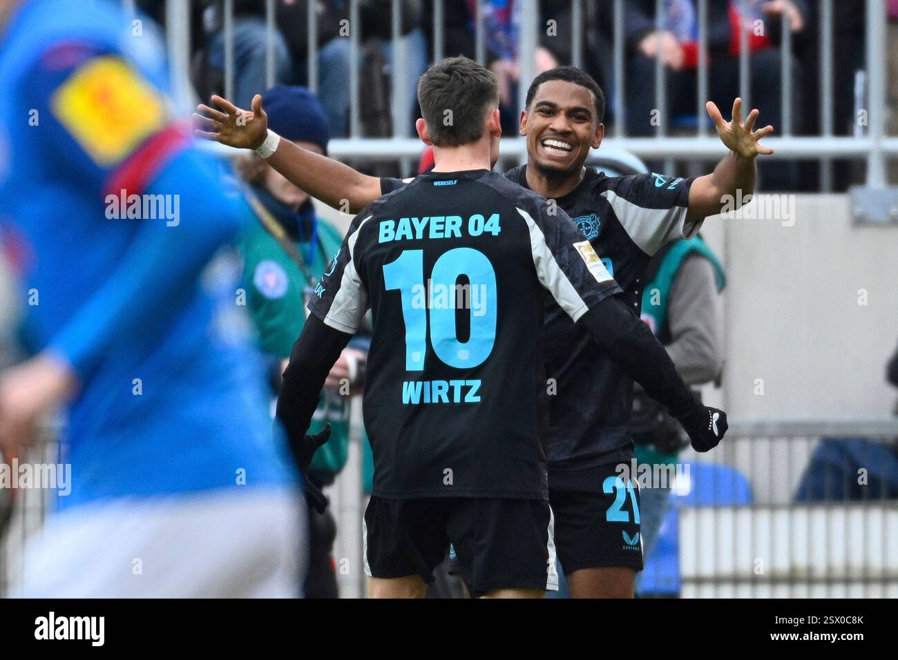Leverkusen's Amine Adli, right, celebrates scoring with teammate ...