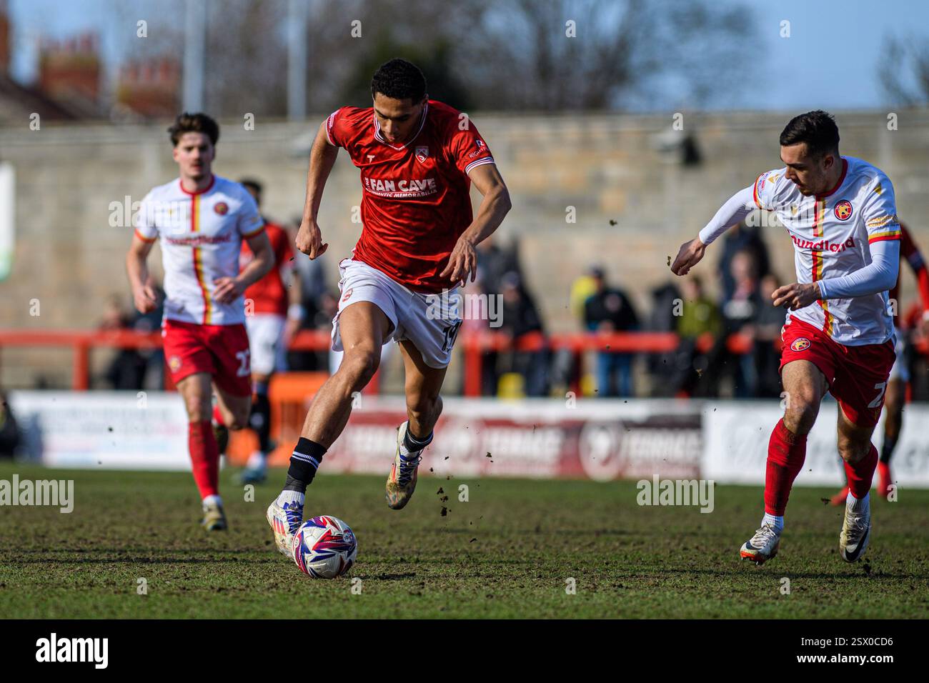 Morecambe FC's Marcus Dackers under pressure from Taylor Allen of ...