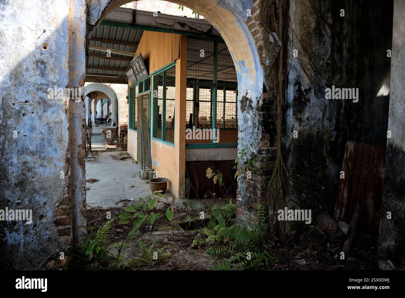 Dilapidated vintage corridor in the abandoned tin mining town of Jalan ...