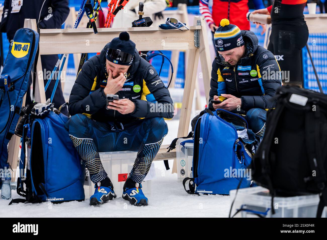 Viktor Brandt and Jesper Nelin of, Sweden. , . with their phones after ...