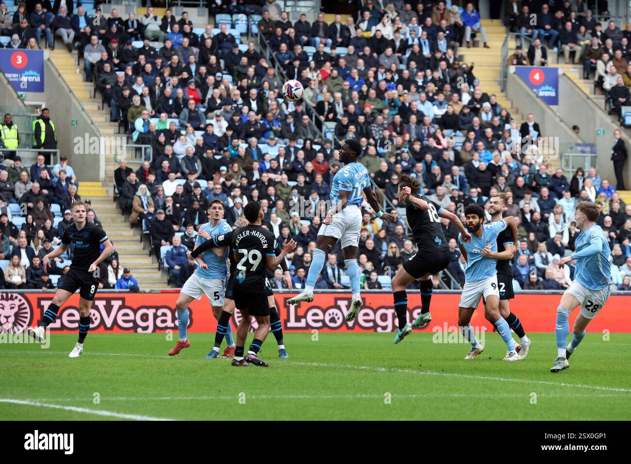 Coventry City's Ephron Mason-Clark has a headed effort towards goal ...