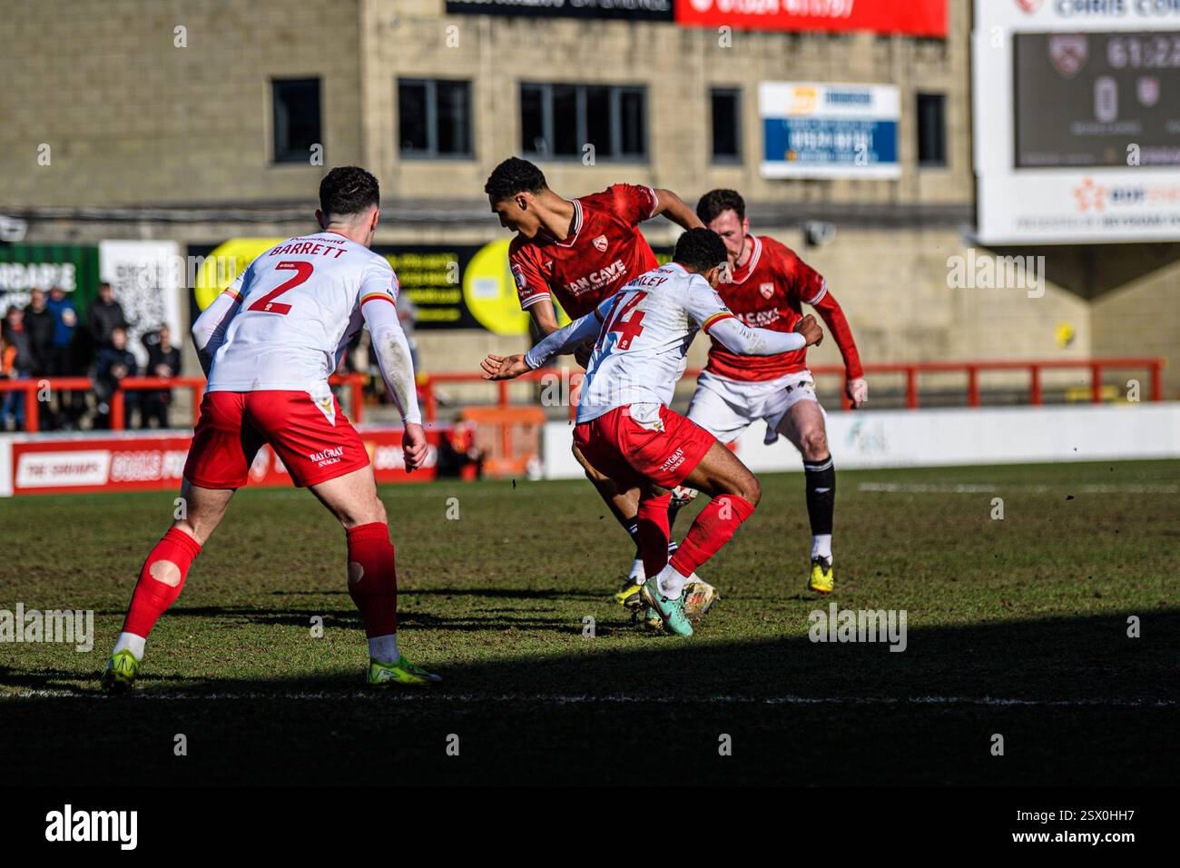 Morecambe FC's Marcus Dackers is tackled by Brandon Comley of Walsall ...