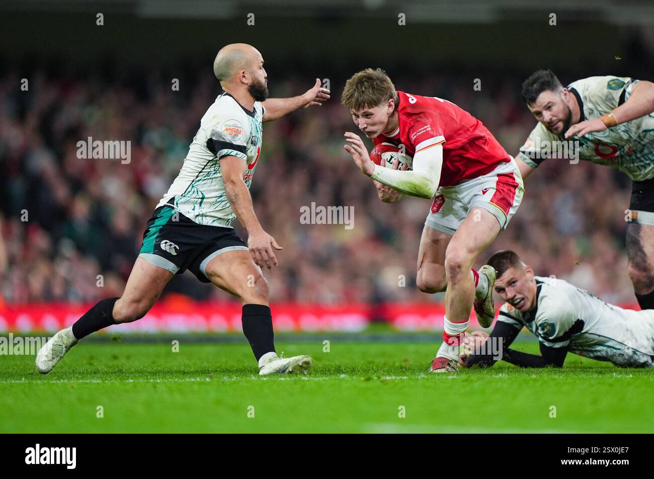 Wales' Ellis Mee is tackled by Ireland's Jamison Gibson-Park during the Guinness Men's Six ...