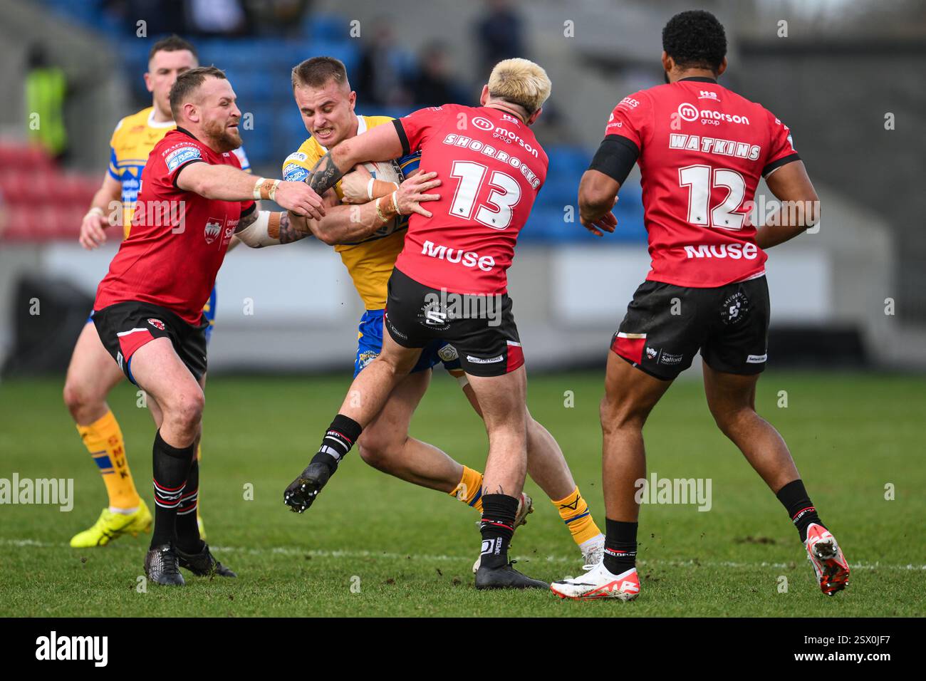 Cooper Jenkins of Leeds Rhinosis tackled by Joe Shorrocks and Brad ...