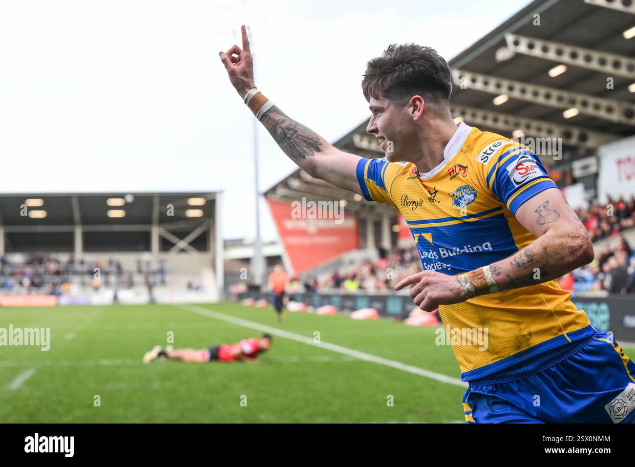 Riley Lumb of Leeds Rhinos celebrates his try during the Betfred Super ...