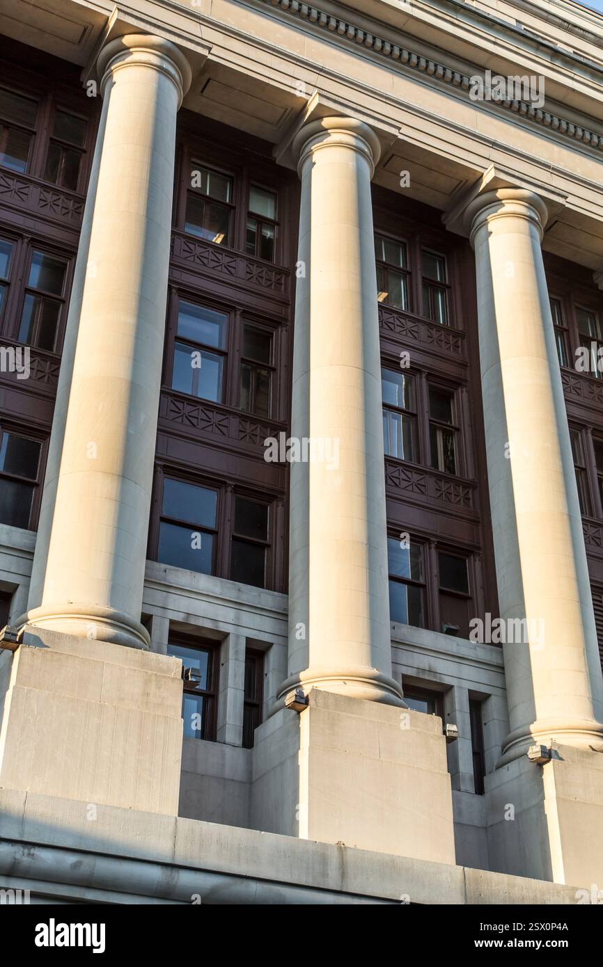 Building with a lot of windows and pillars. The pillars are white and ...