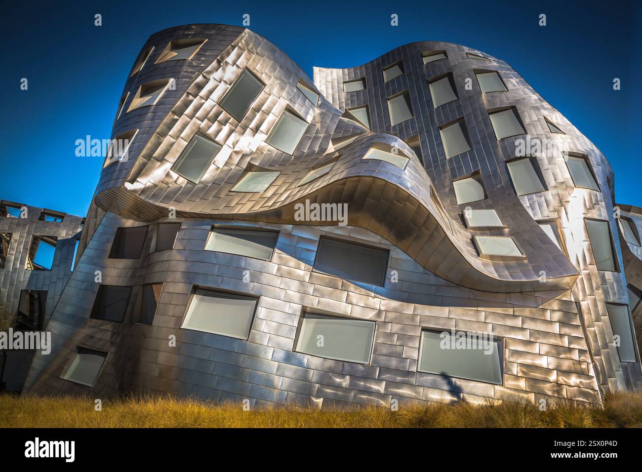 Building with a lot of windows and a curved roof. The building is ...