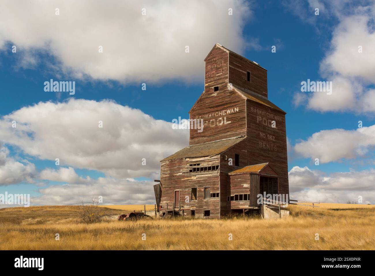 Large, old grain silo with a sign on the side that says "Pool". The ...
