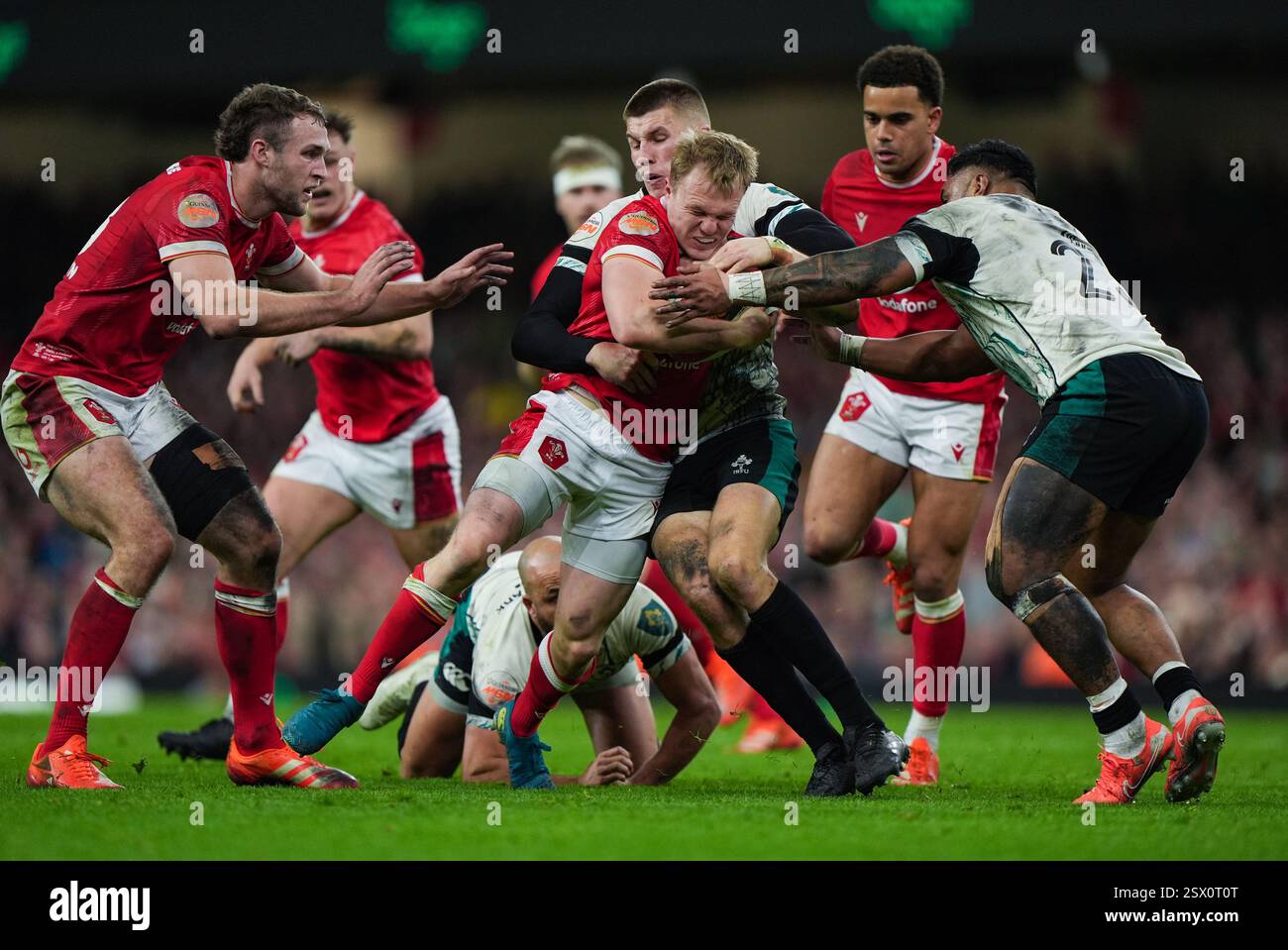 Wales' Blair Murray is tackled by Ireland's Sam Prendergast during the ...