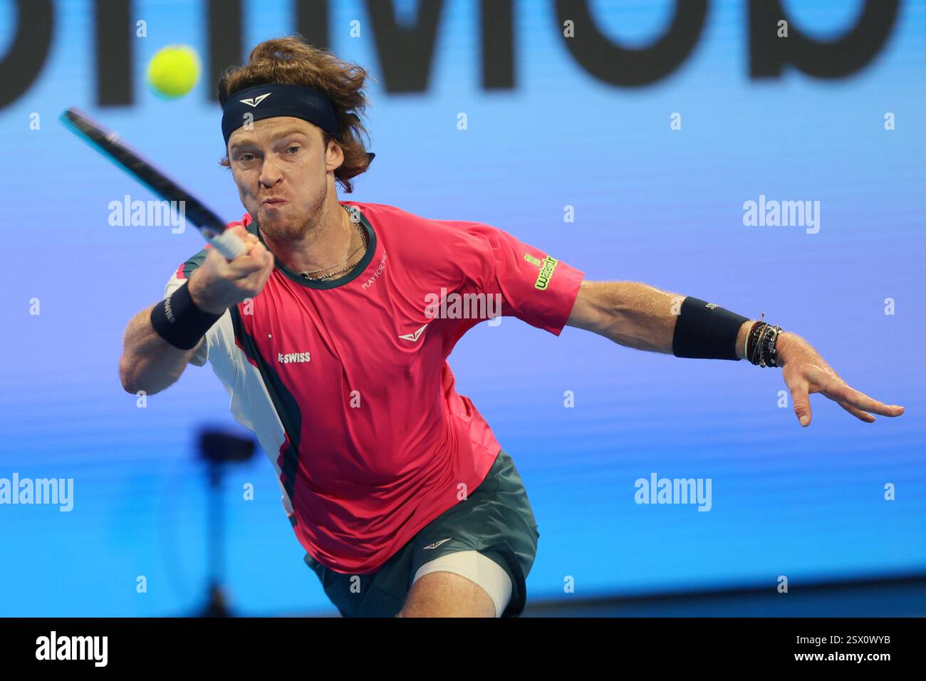Russia's Andrey Rublev plays a shot against Britain's Jack Draper ...