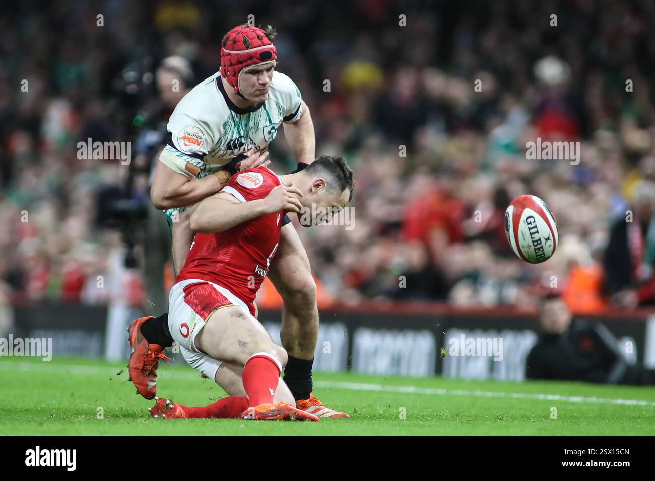 Cardiff, UK. 22nd Feb, 2025. Josh van der Flier of Ireland collides ...