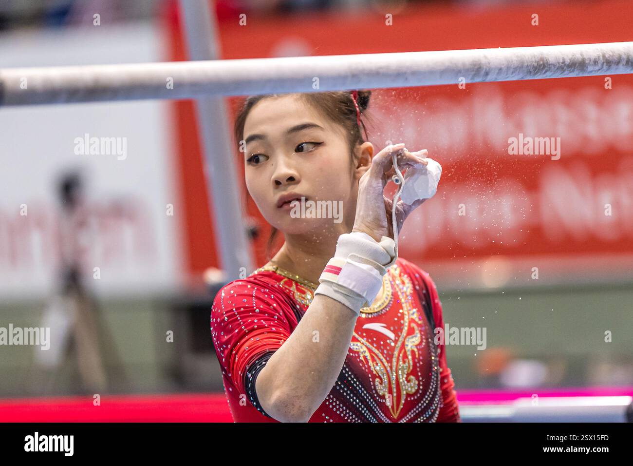 Cottbus, Germany. 22nd Feb, 2025. Gymnastics: World Cup, uneven bars women's final: Kexin Zhang ...