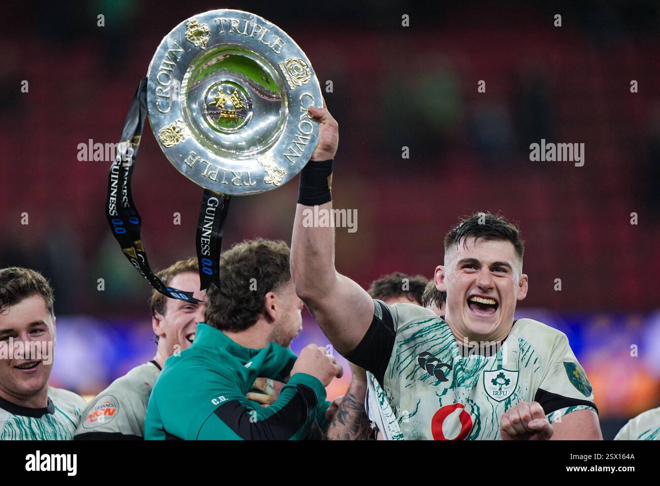 Ireland's Dan Sheehan lifts the Triple Crown trophy after the Guinness ...
