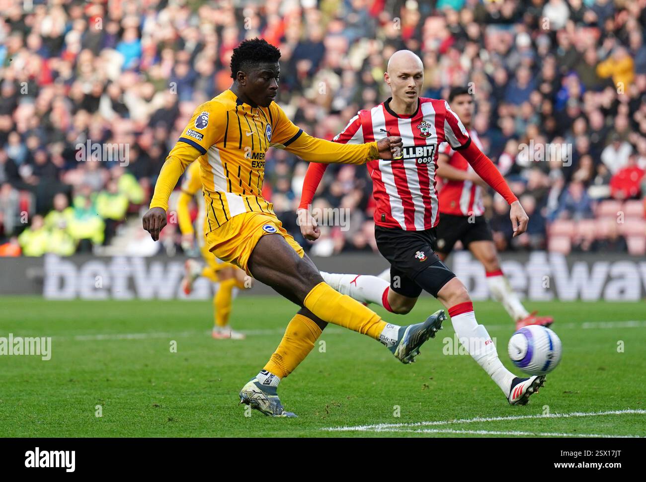 Brighton and Hove Albion's Carlos Baleba has a shot on goal during the ...