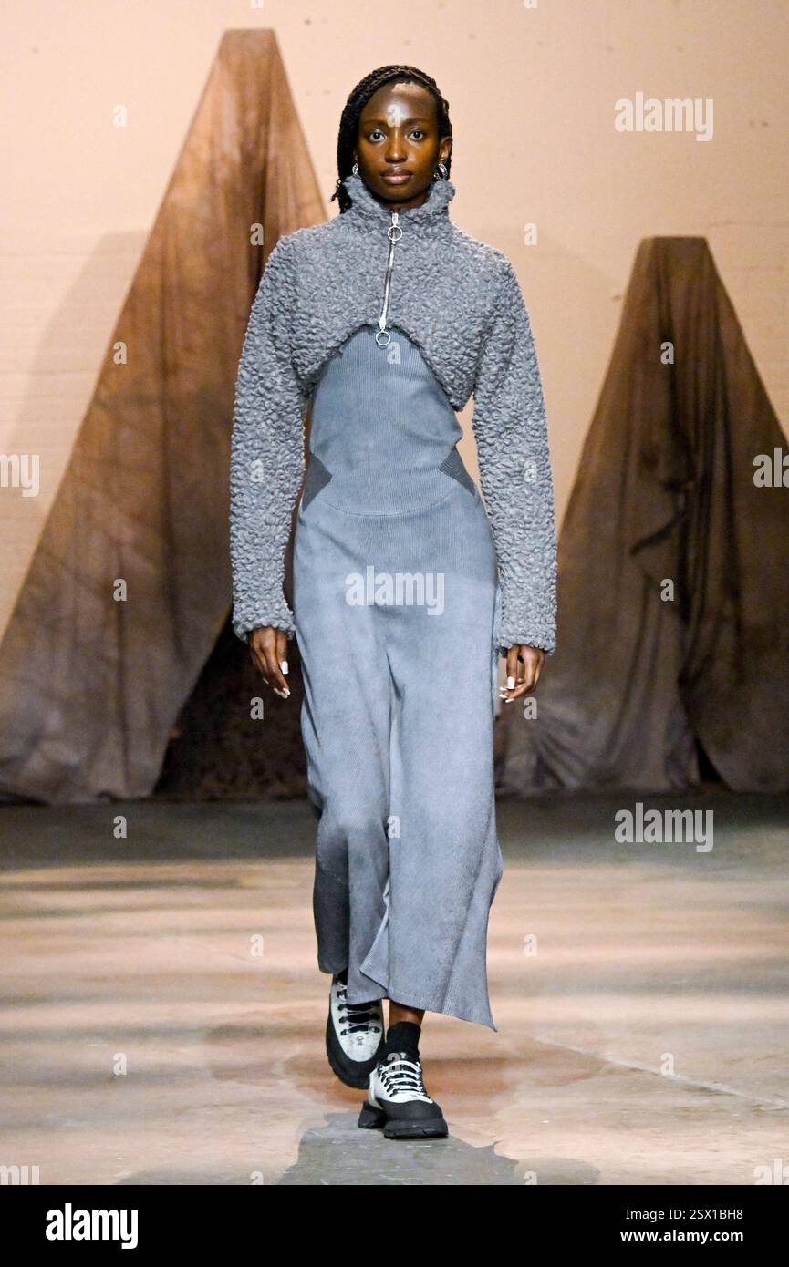 London, UK. 22nd Feb, 2025. A model is seen on the runway during the ...