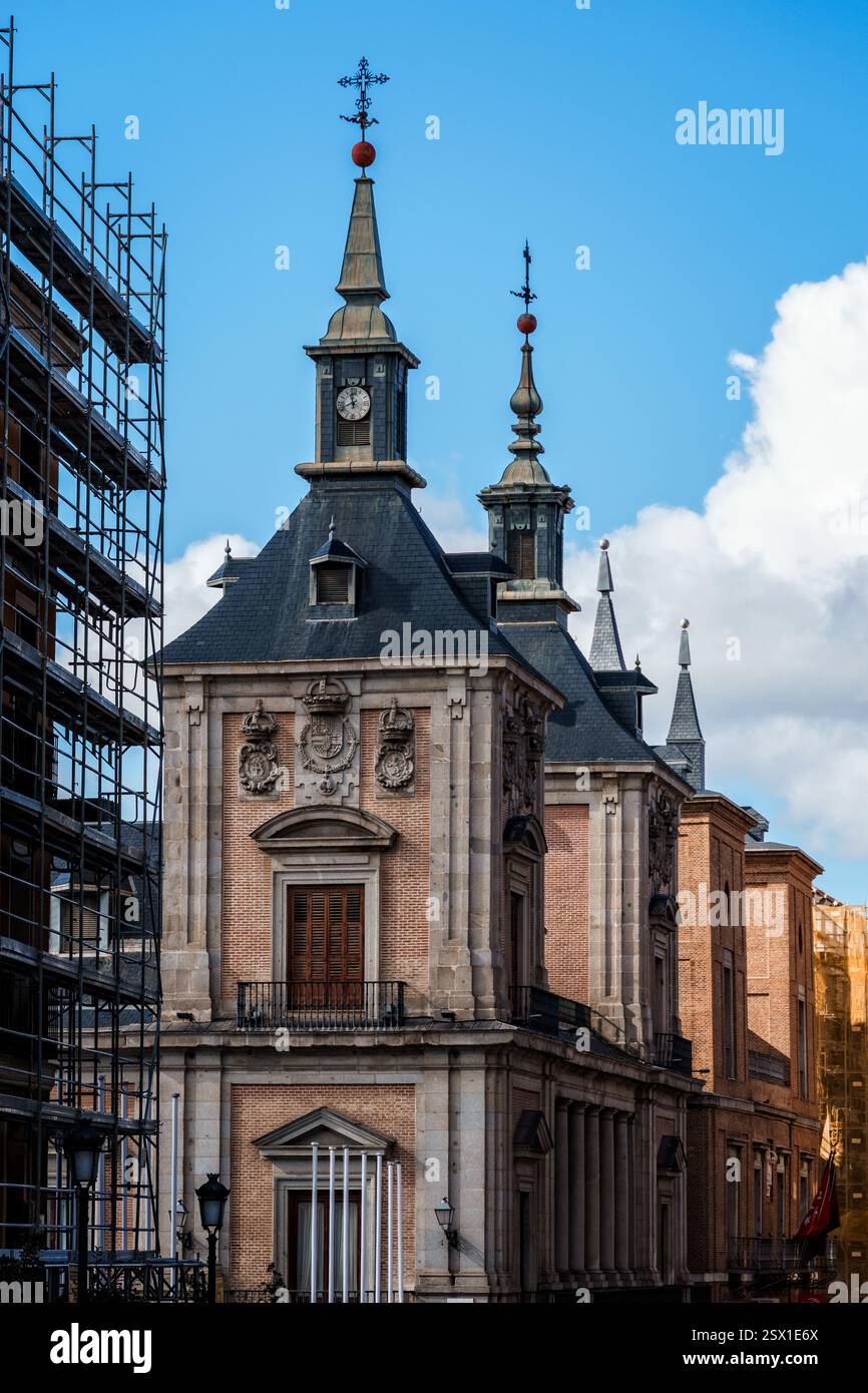 A low-angle shot of a detailed white building with a black spire in ...