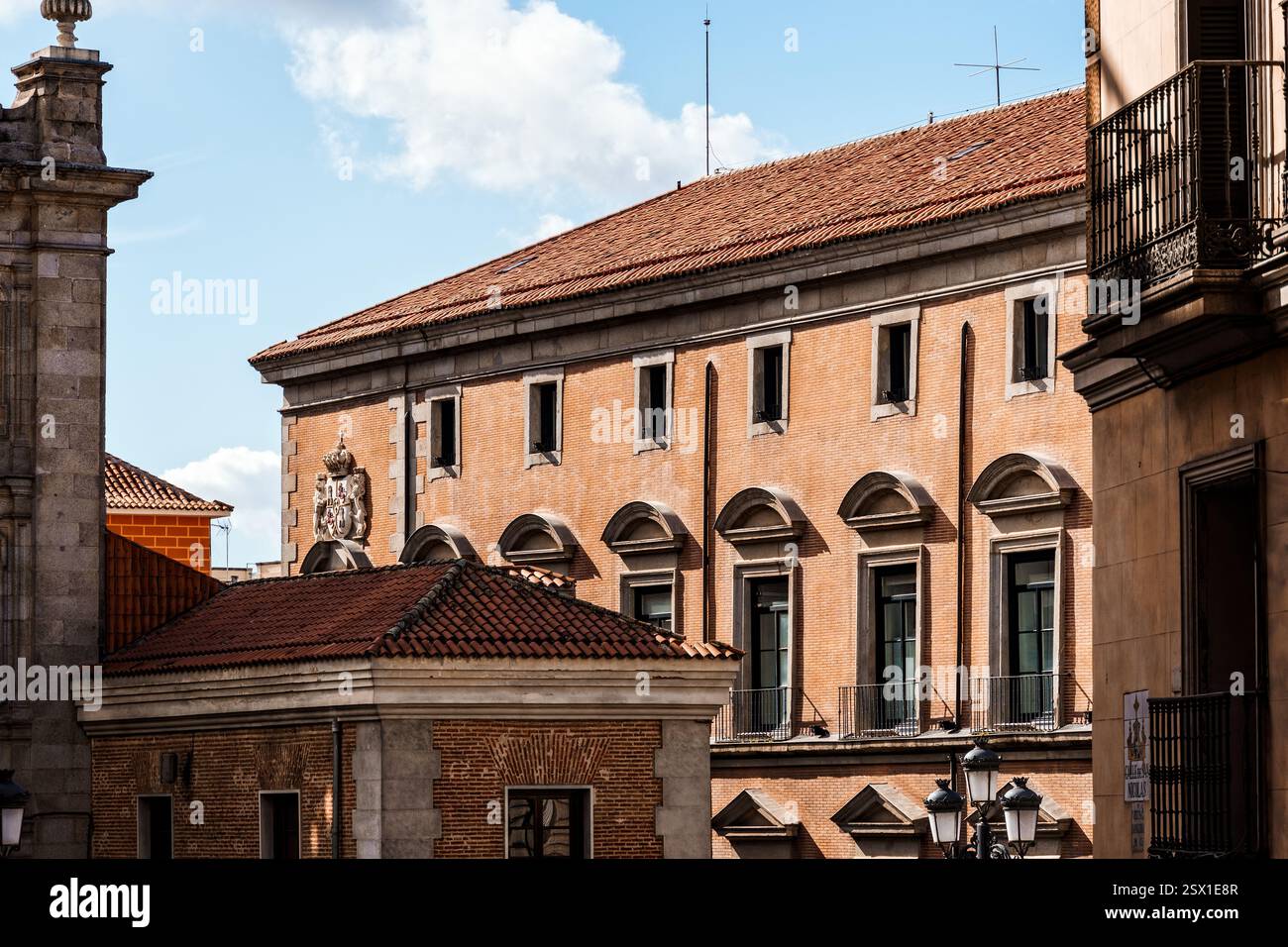 Classical architecture with a tiled roof and wrought-iron balconies ...
