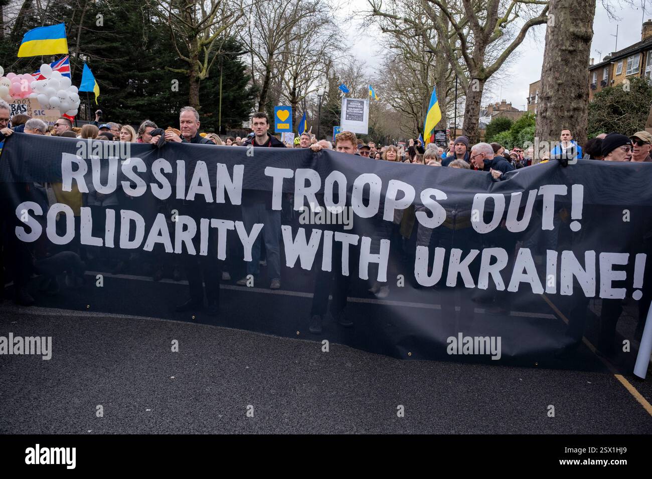 Russian troops out, solidarity with Ukraine banner as Ukrainians and ...
