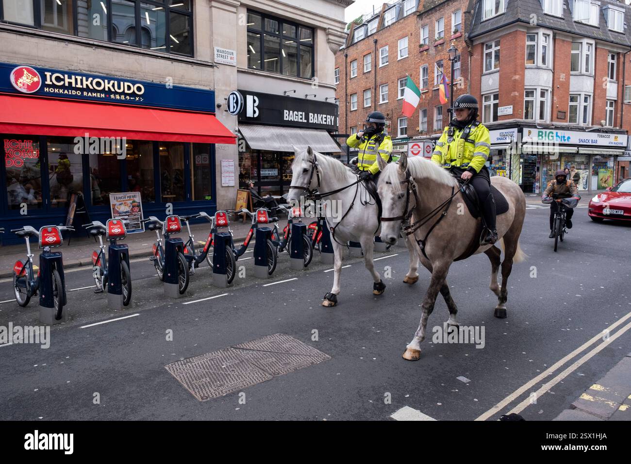 Mounted Metropolitan Police on patrol on Wardour Street in Soho on 29th ...