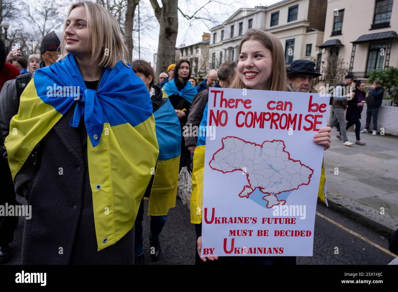 Ukrainians and supporters of Ukraine gather to march towards the ...