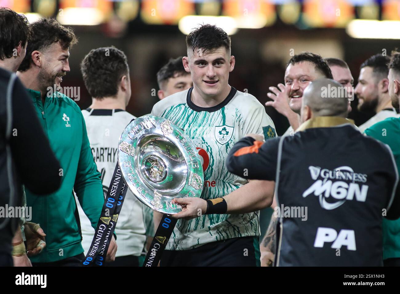 Dan Sheehan of Ireland holds the triple crown trophy during the 2025 Guinness 6 Nations match ...