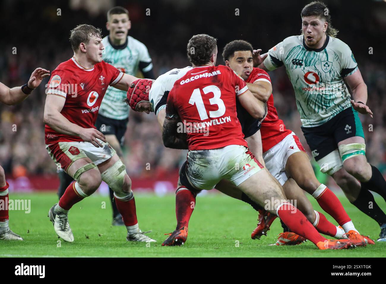 Josh van der Flier of Ireland is tackled by Ben Thomas and Max ...