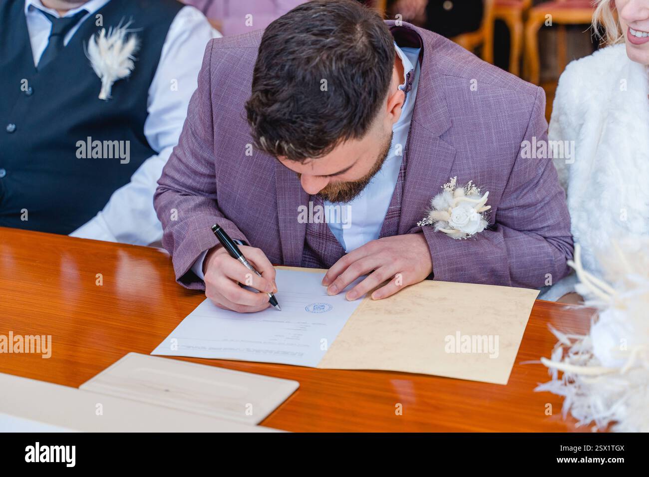 Bavaria, Germany - January 19, 2024: A groom signs the marriage ...